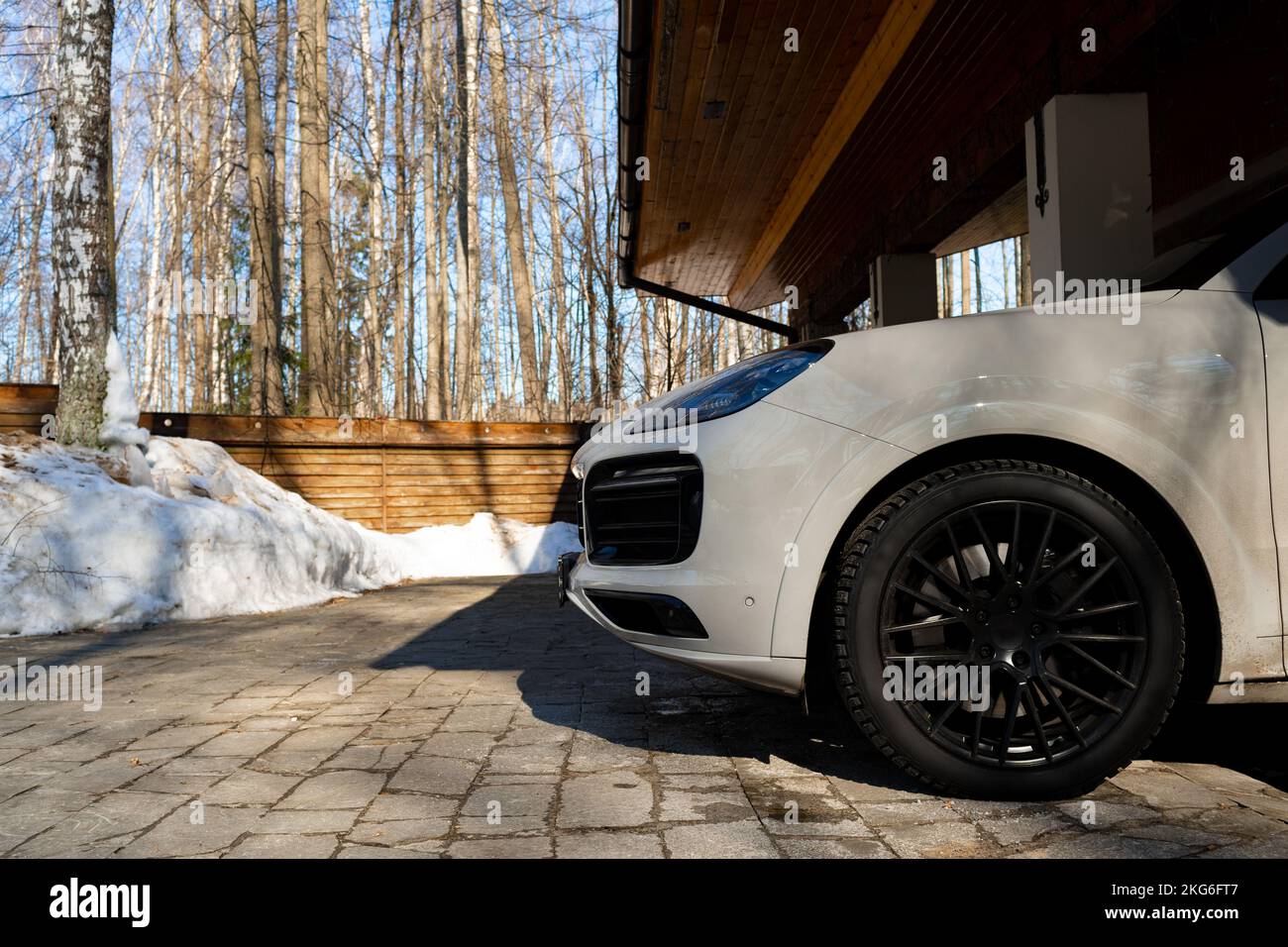 White car parked in the backyard of modern house Stock Photo - Alamy