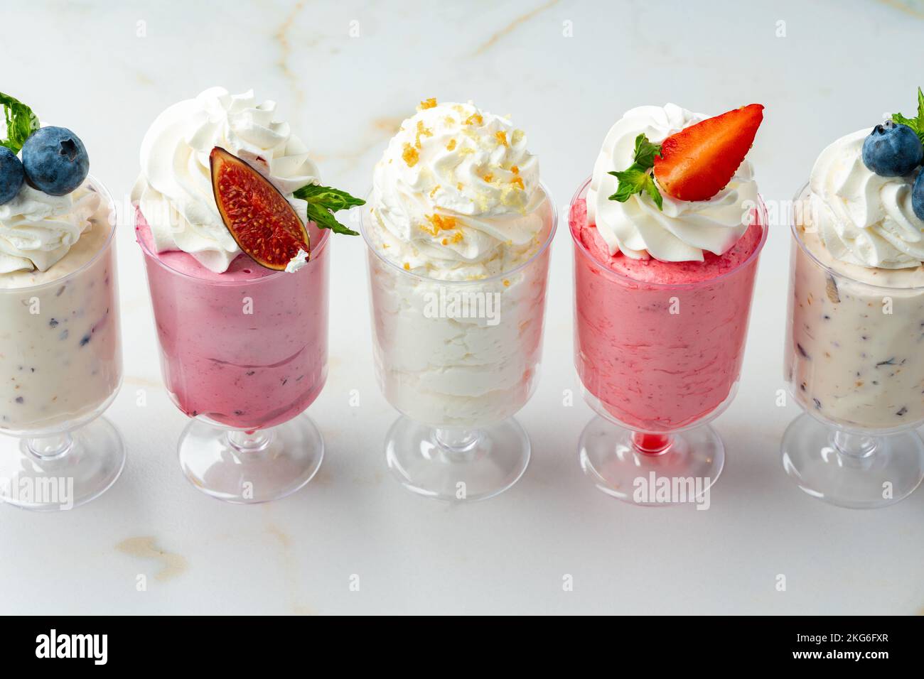 Large collection of mousse desserts in glasses for catering Stock Photo ...