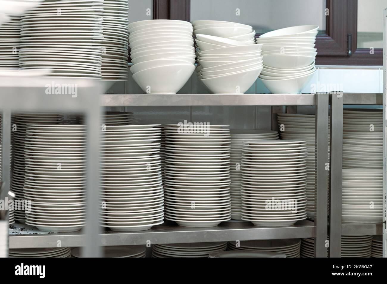 Plenty of stacked plates in the kitchen cupboard Stock Photo - Alamy