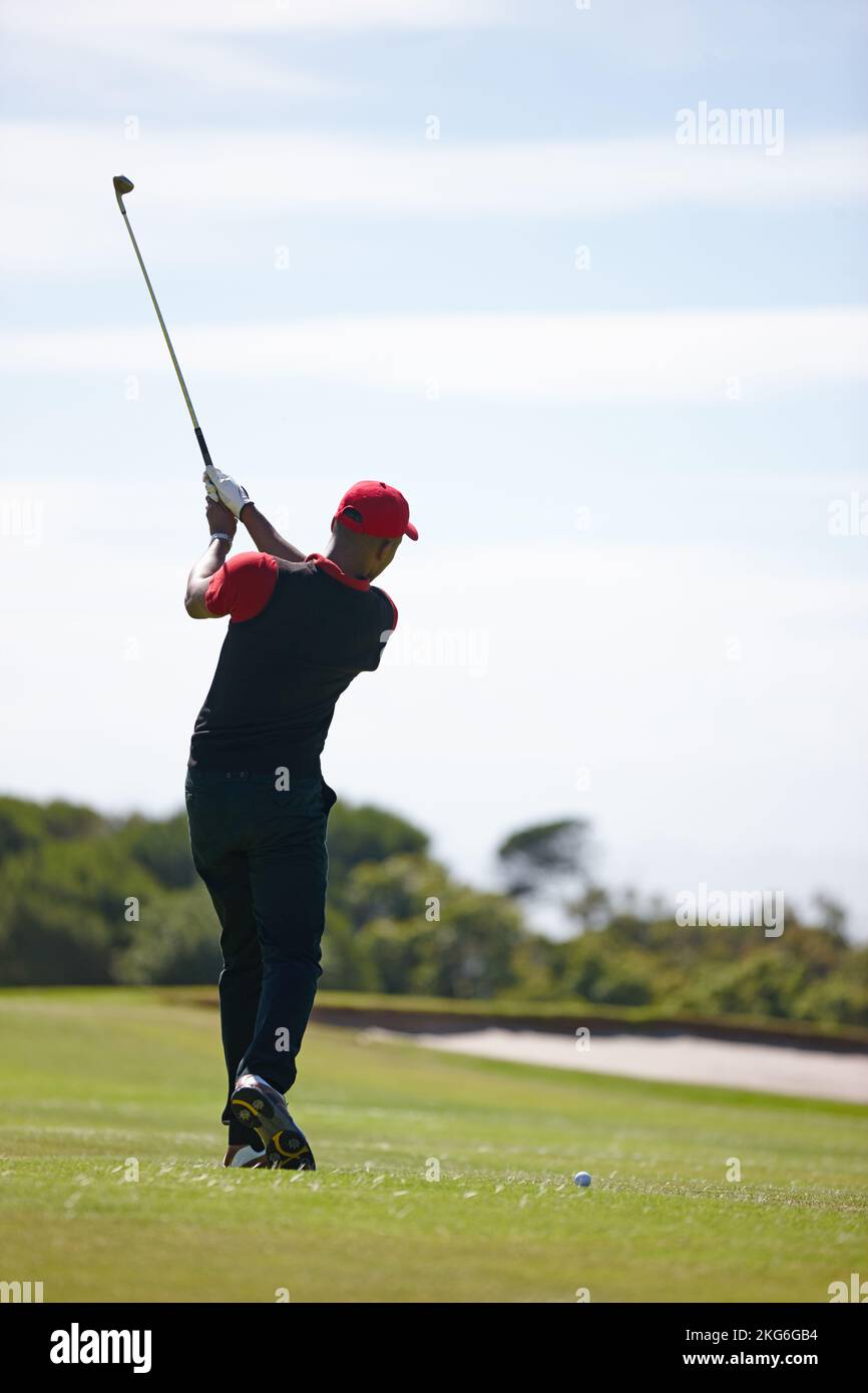 Sport holding standing golf club hitting sand trap hi-res stock ...