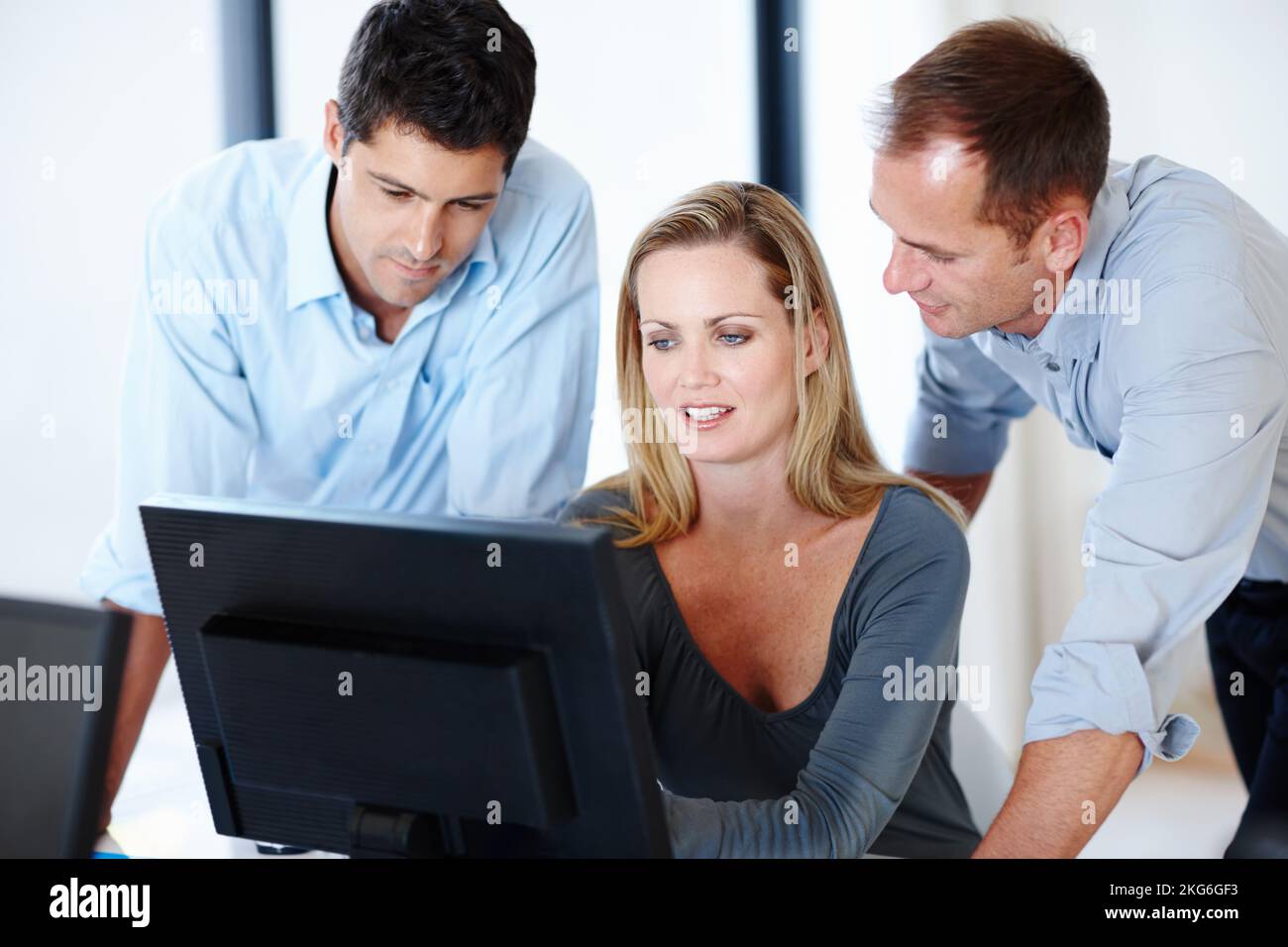 Lets turn these dreams into reality. A team of collegues huddling ...