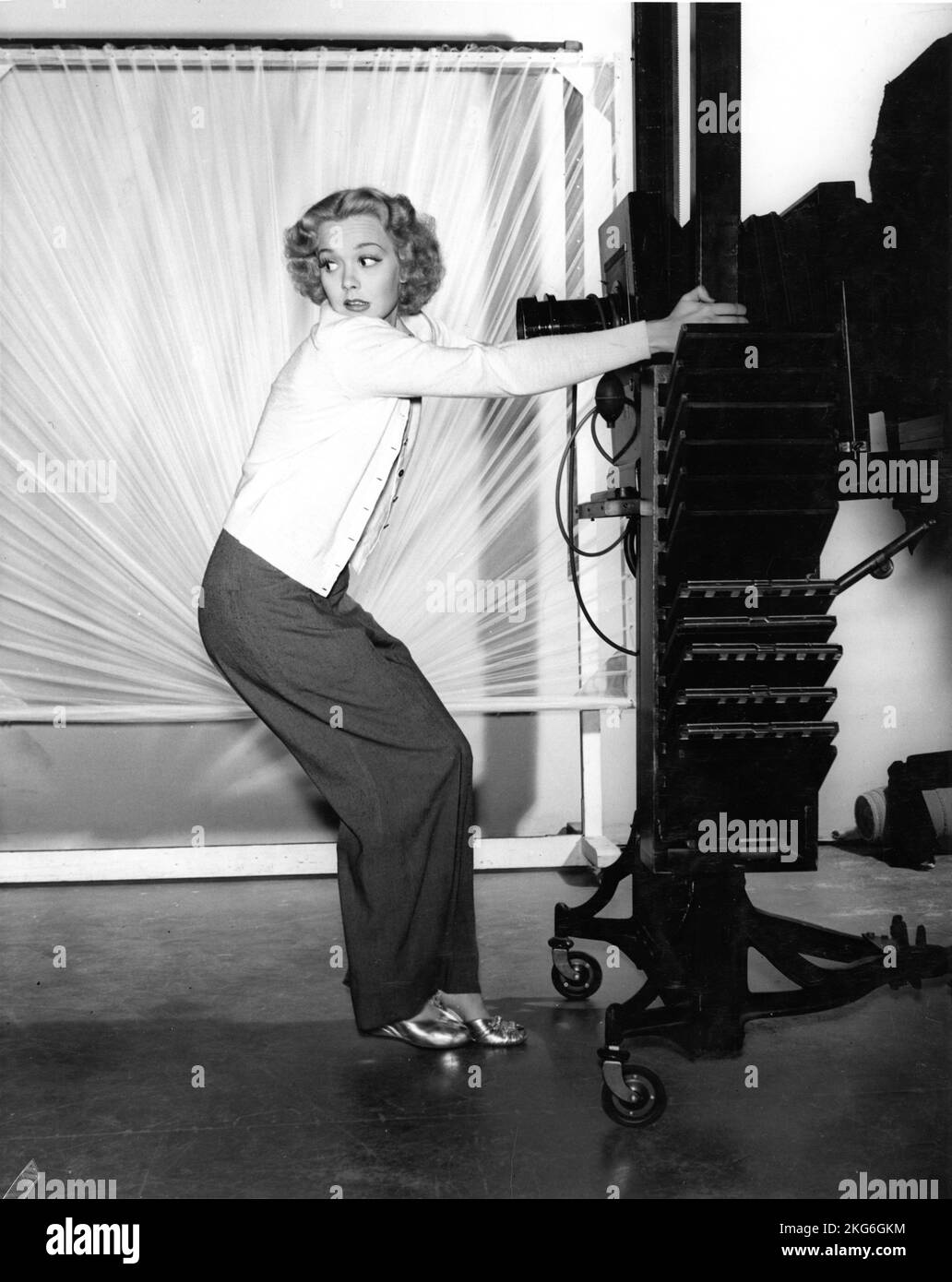 JANE WYMAN circa 1938 changing position of Still Camera at Warner Bros ...