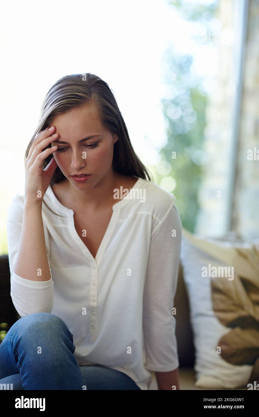 Living in the age of anxiety. A cropped shot of a stressed young woman ...
