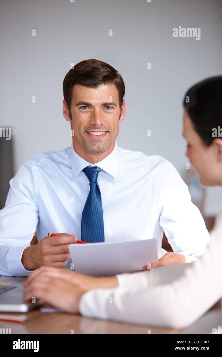 I need you to send this to everyone. two business colleagues sitting ...