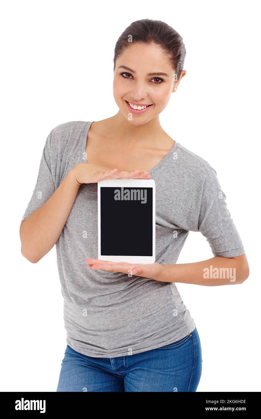 The avid readers best friend. Studio shot of an attractive young woman holding up a digital ...