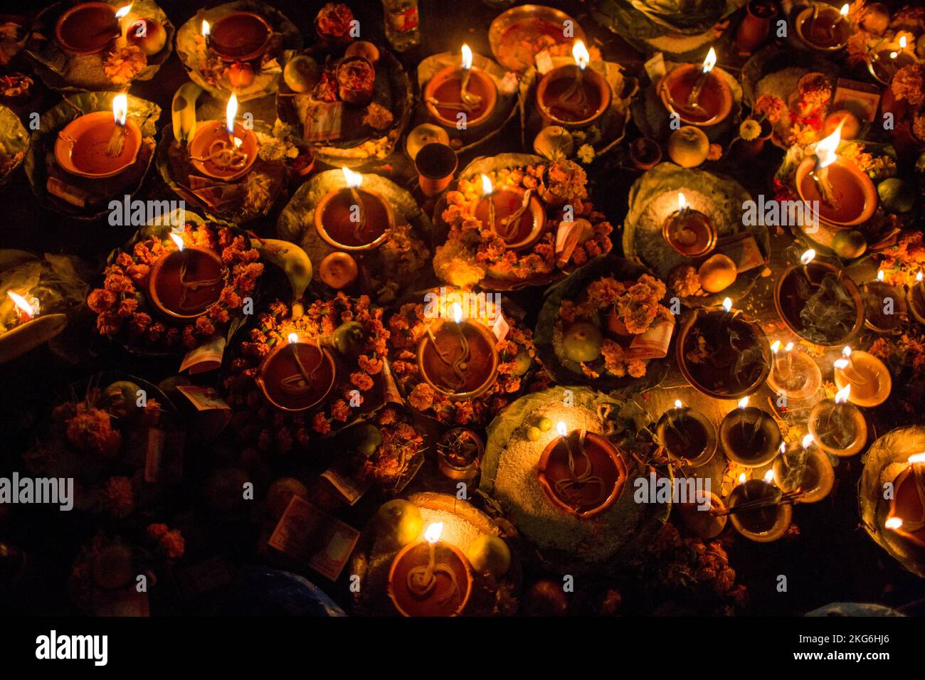 Kathmandu, Nepal. 21st Nov, 2022. Oil lamps and the offerings are ...