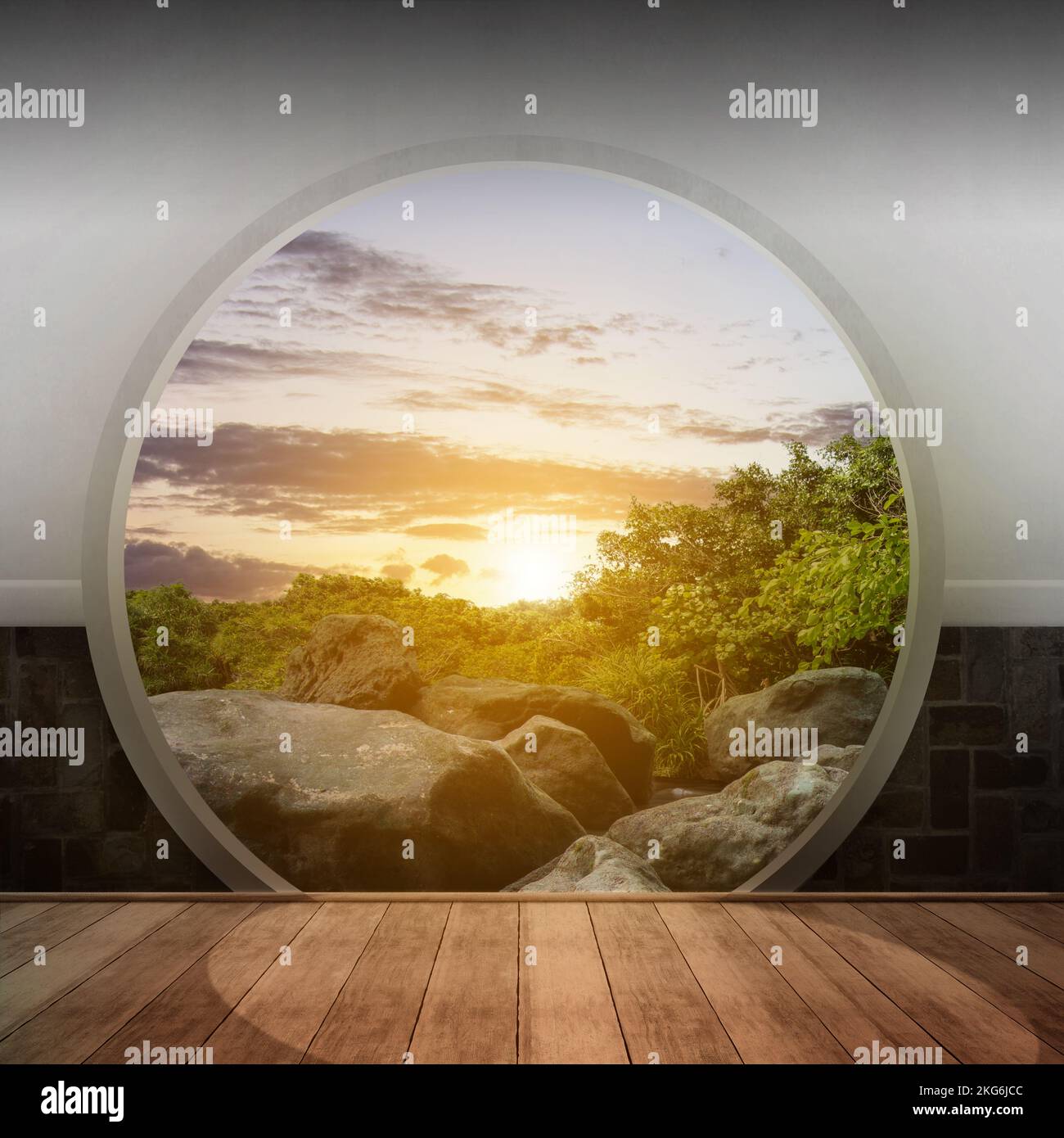 Circle gate with a view of green garden and trees over sunset sky ...
