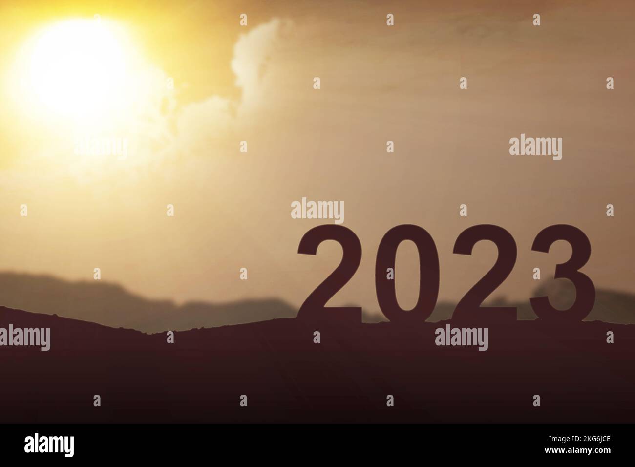 2023 on the field with a sunset sky background. Happy New Year 2023 ...