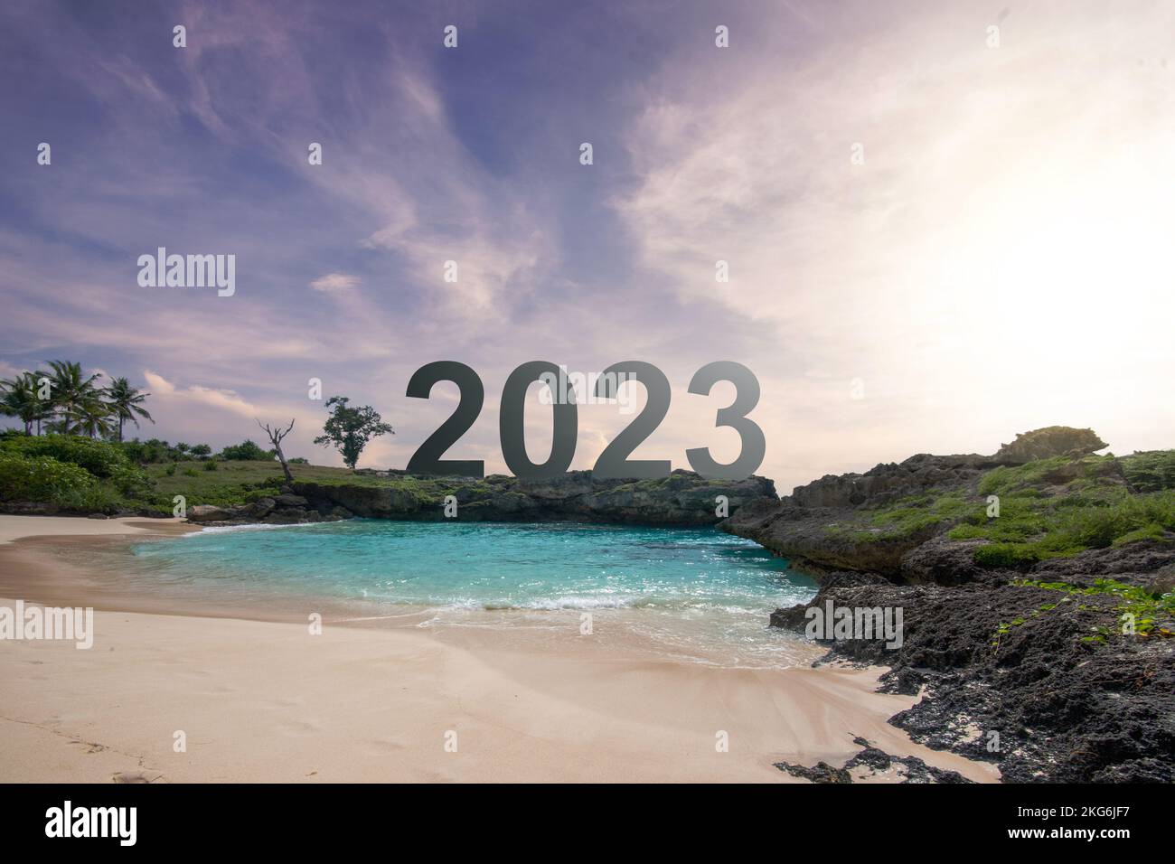 2023 on the beach with a sunset sky background. Happy New Year 2023 ...