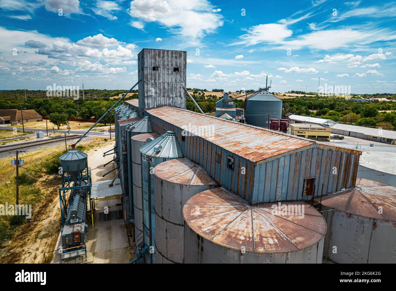 A vertical steel tank of the factory Stock Photo - Alamy