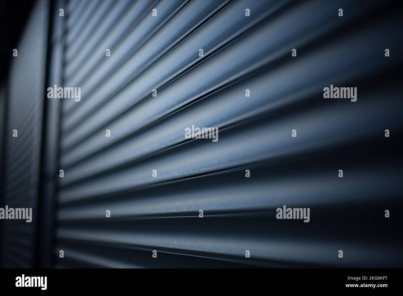 Blinds on windows of store. Steel blinds for large windows. Ribbed ...