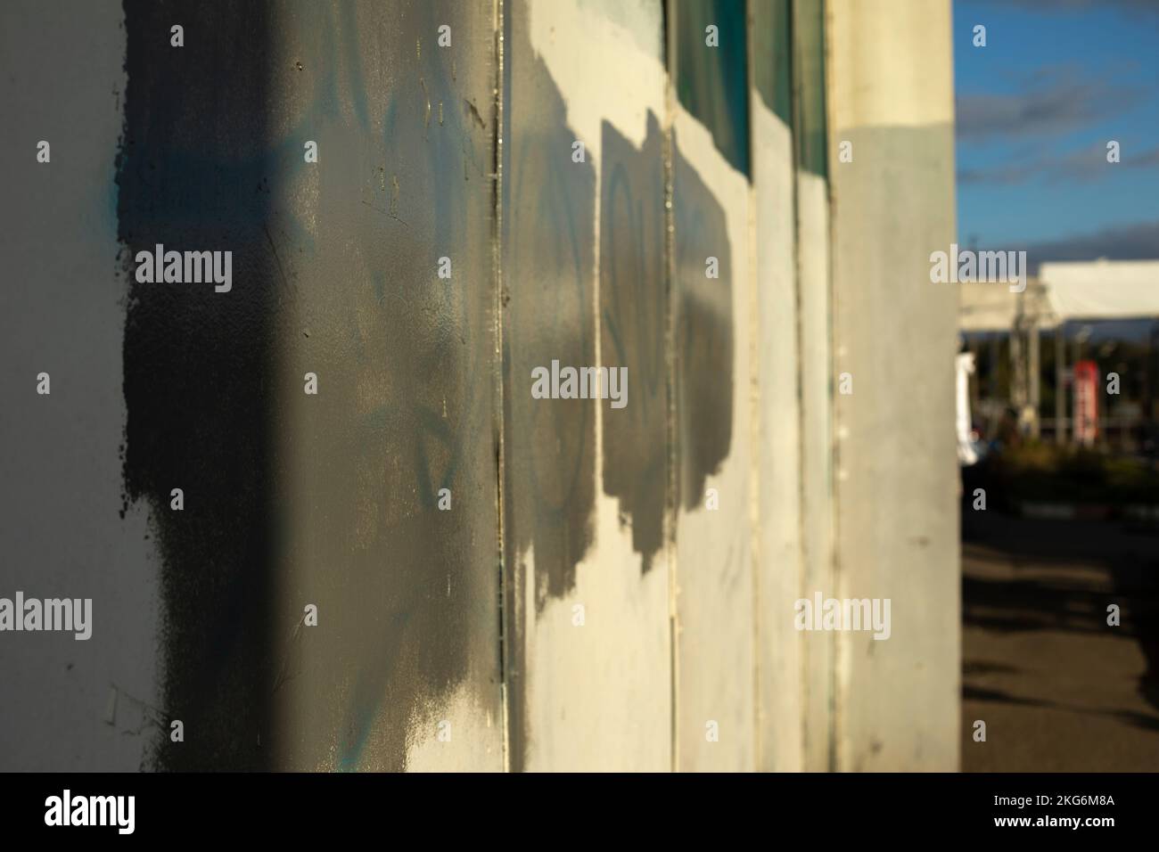Gray paint on wall. Painted over graffiti. Fight against vandalism ...