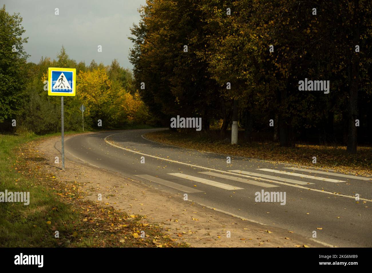 Turning road. Pedestrian crossing across street. Track details. Road in ...