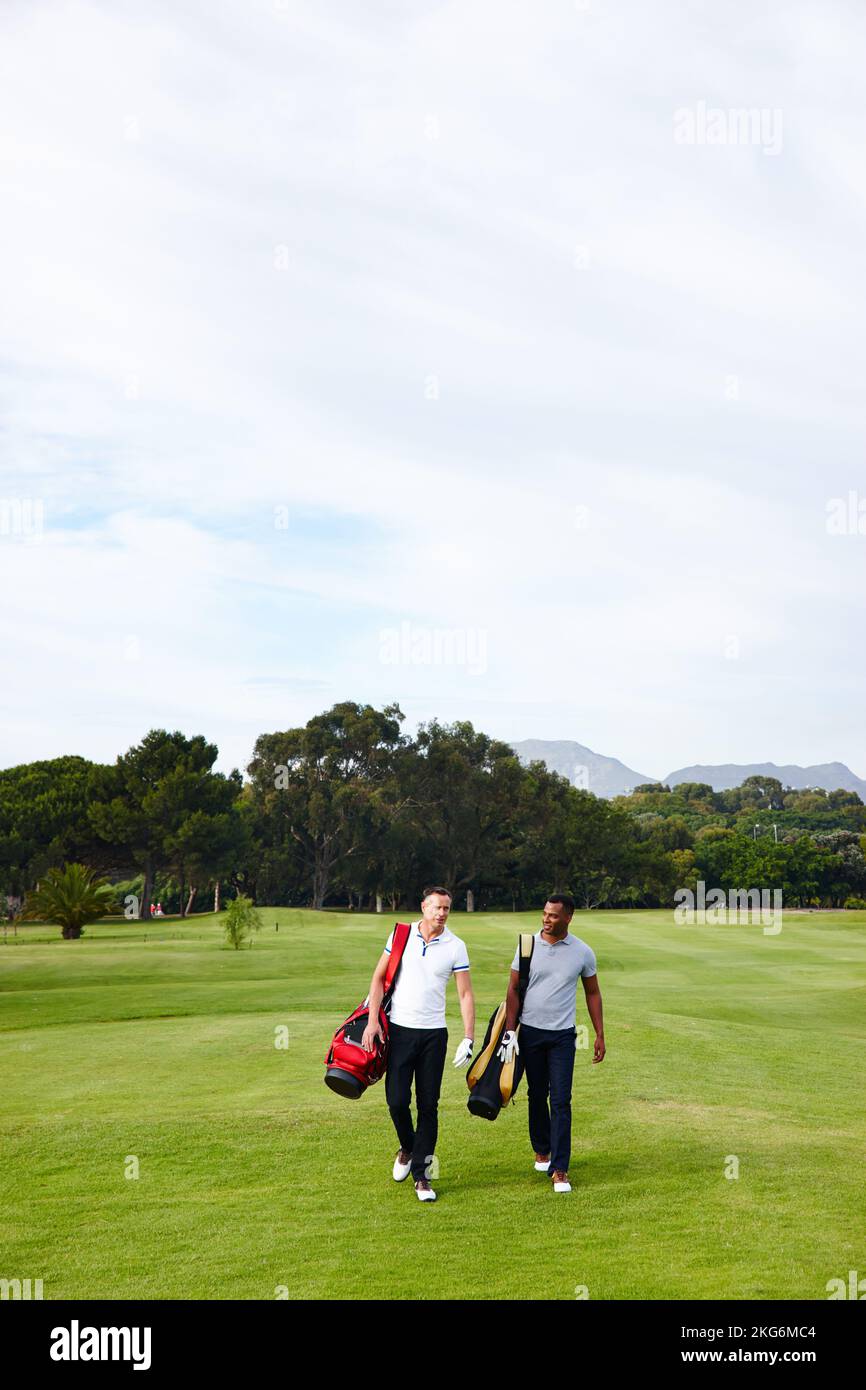 Two men walking together hi-res stock photography and images - Alamy
