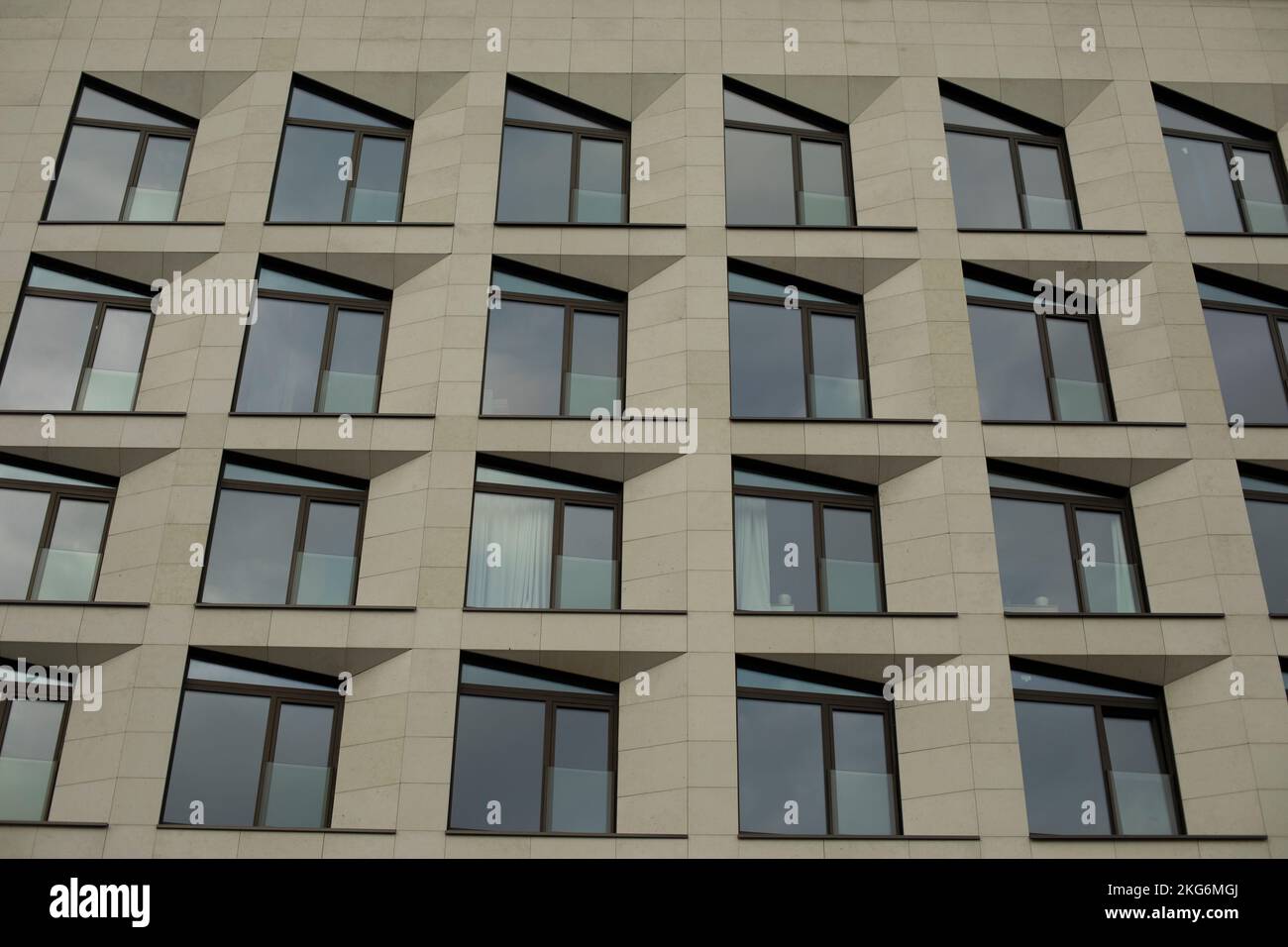 Windows in building are textured. Modernist style in architecture ...