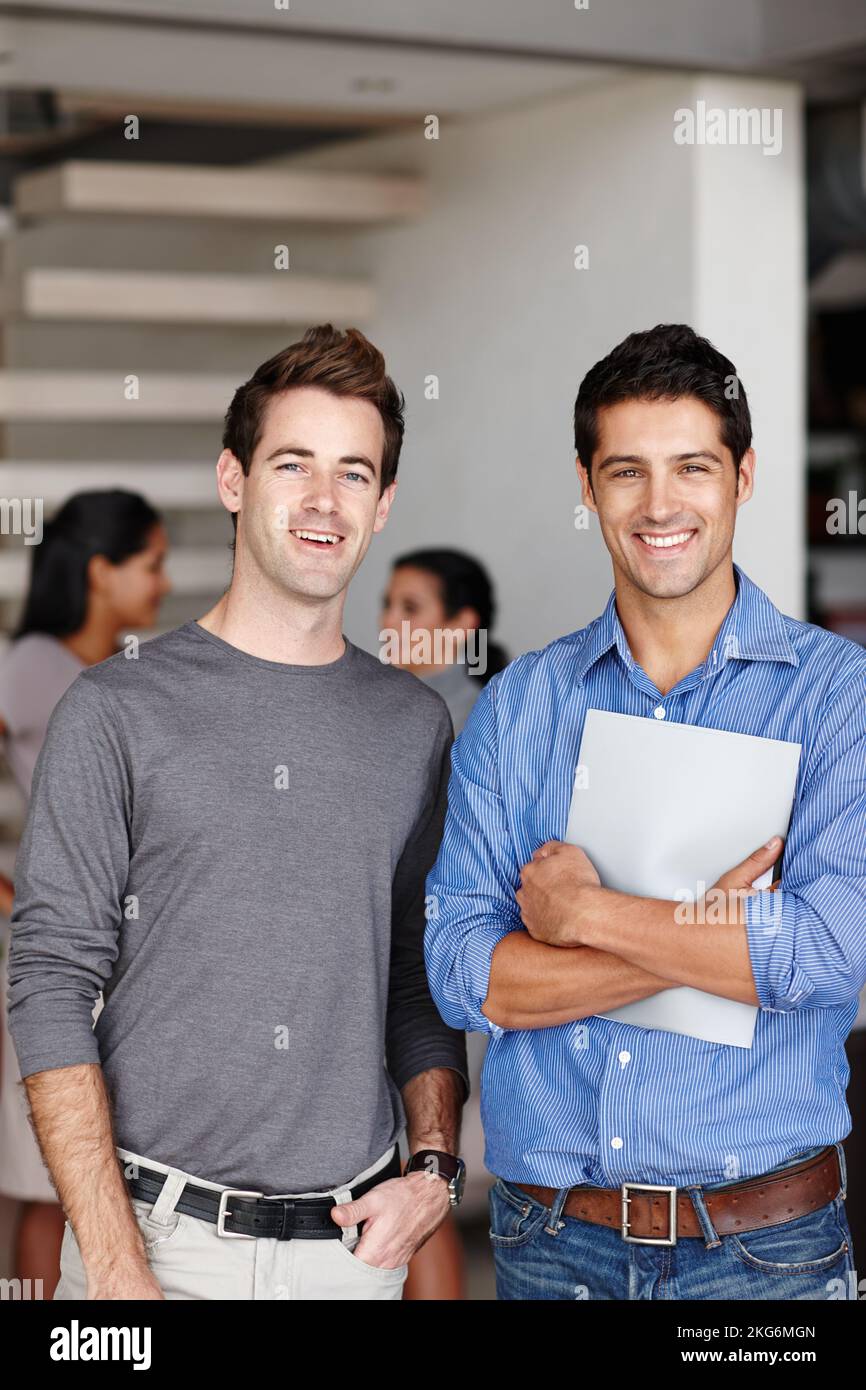 Satisfied with the work theyre producing. Portrait of two creative ...