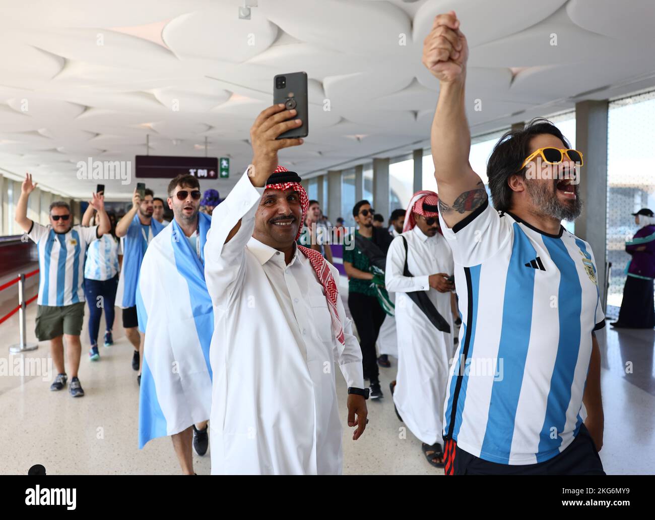 Doha, Qatar. 22nd Nov, 2022. Saudi Arabian and Argentina fans mix on the way to their game ...