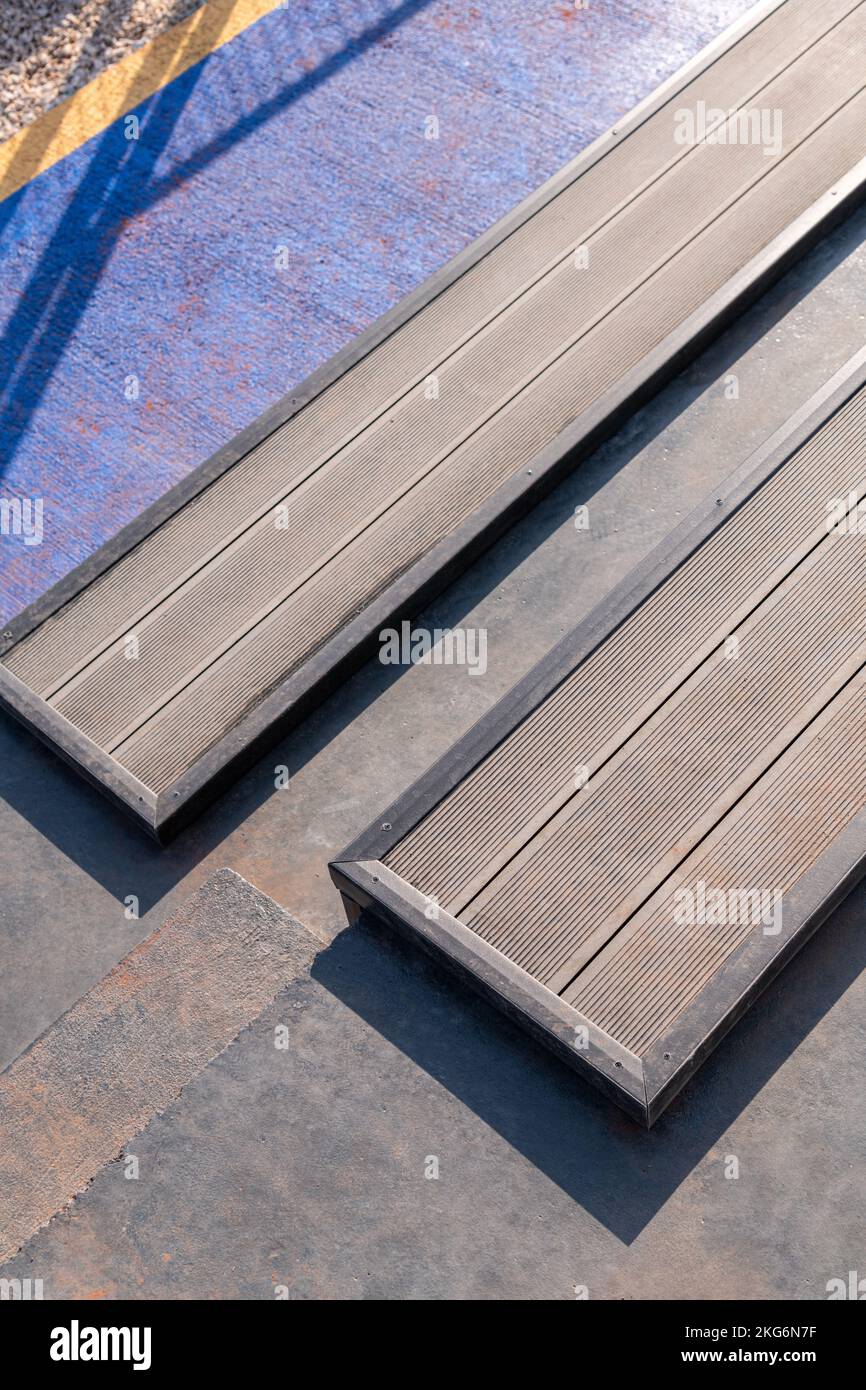 Seating area for spectators made with composite deck next to the tennis ...