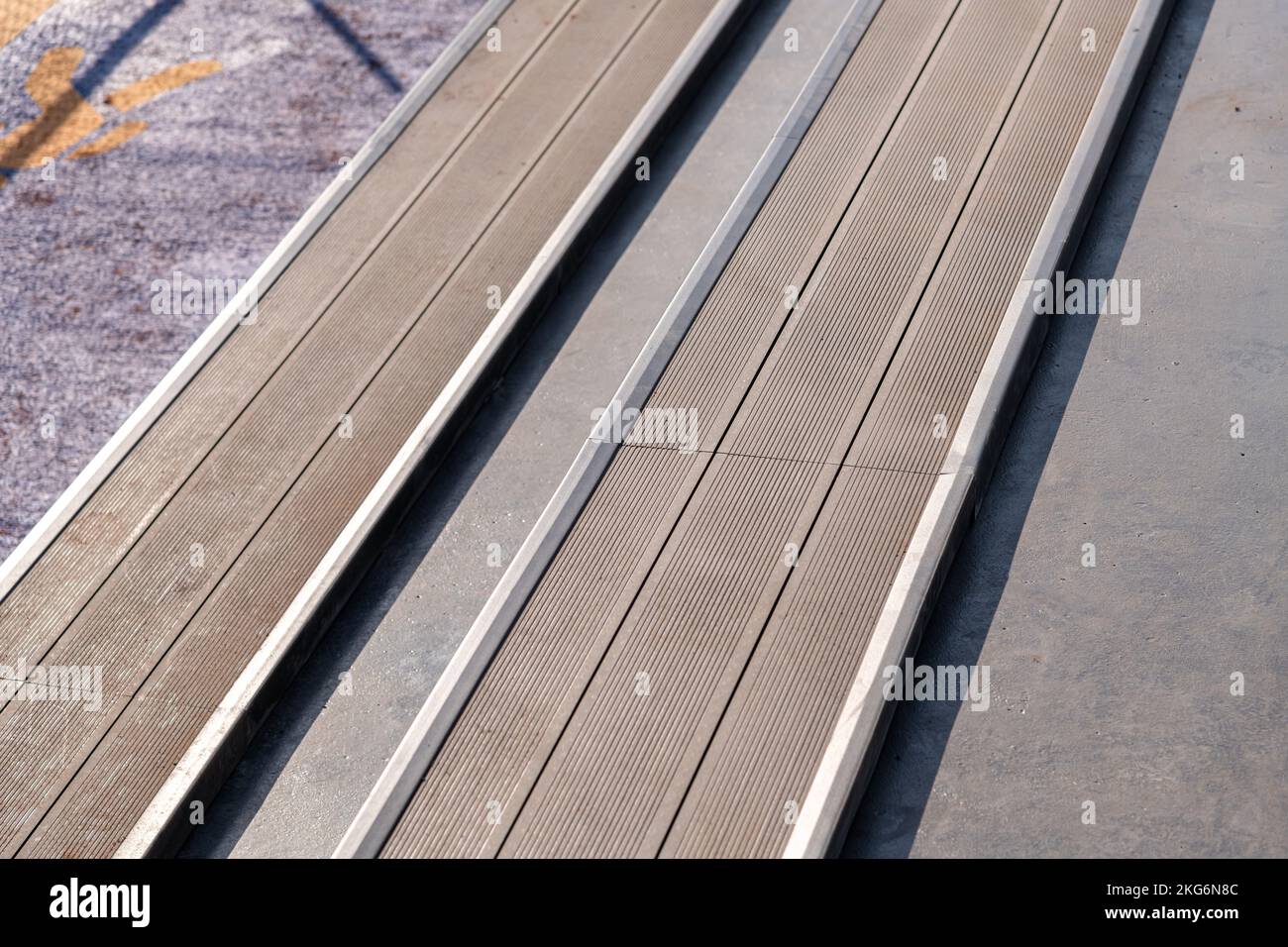 Seating area for spectators made with composite deck next to the tennis ...
