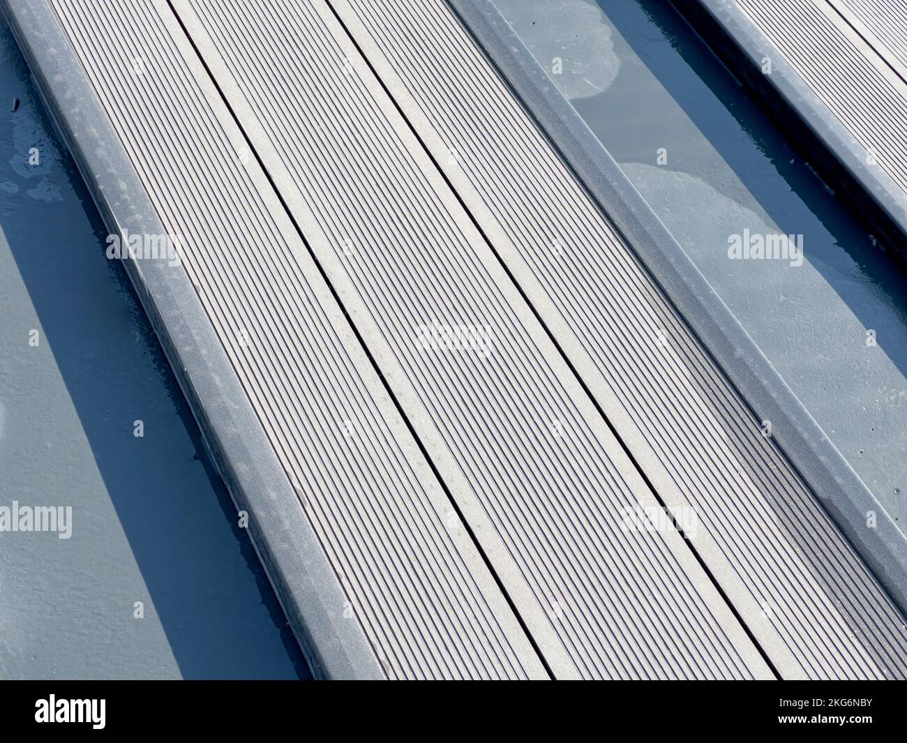 Seating area for spectators made with composite deck next to the tennis ...