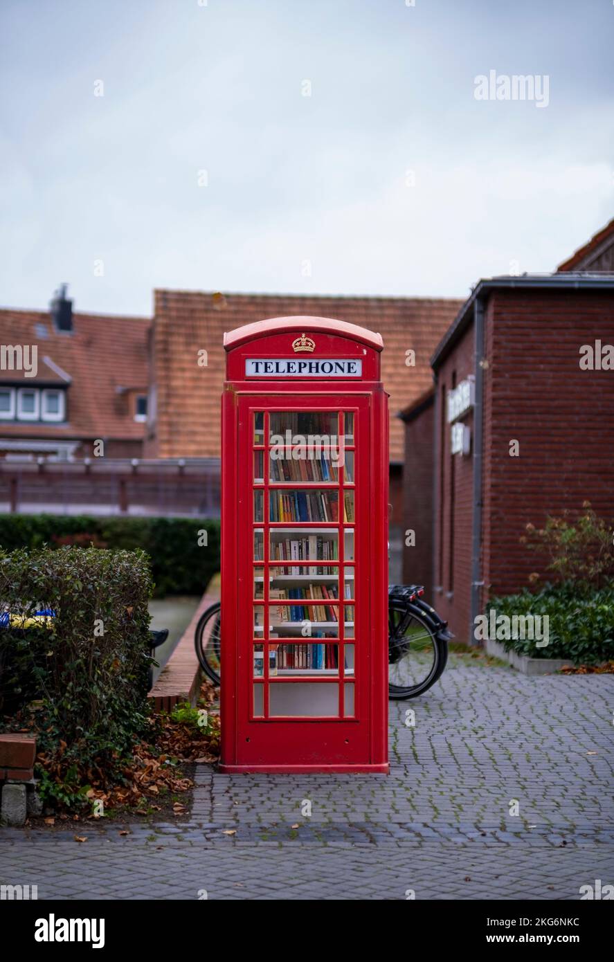 A bookcase that looks like a phone booth. Public bookcase in old red ...
