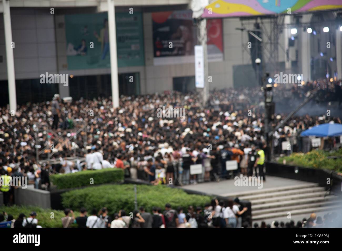 People crowd watching event festival concert outdoor blurred background ...
