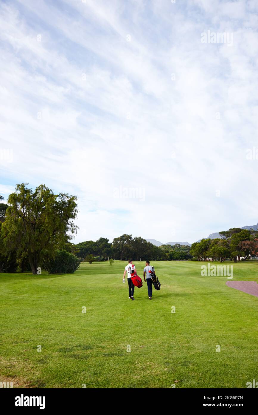 Getting out amongst nature. Rear view shot of two friends out on the ...