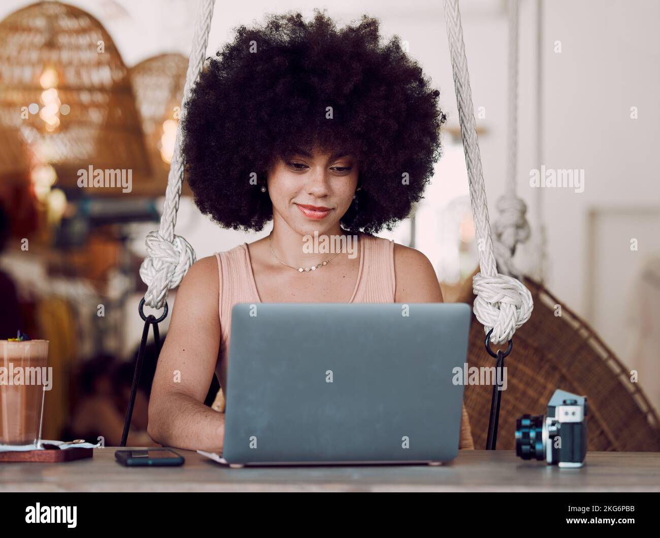 Entrepreneur, laptop or black woman at coffee shop typing blog article ...