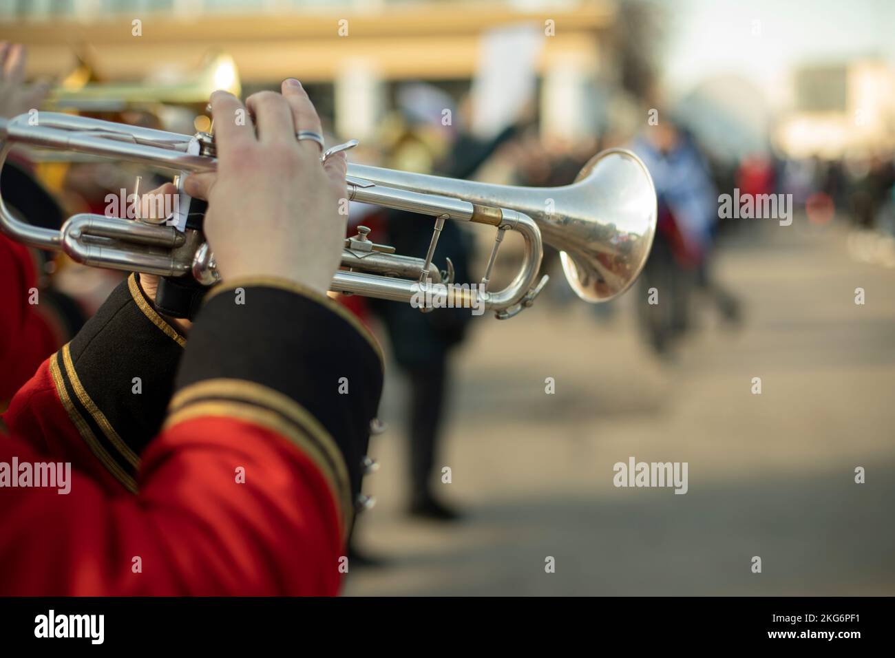 Military band in parade. Trumpeters on street. Trumpeter plays tune ...