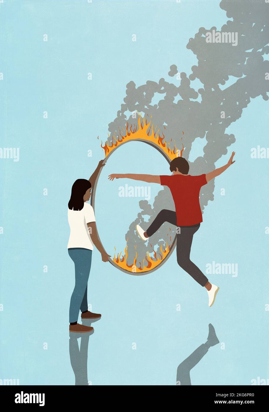 Man jumping through burning hoop for woman Stock Photo - Alamy