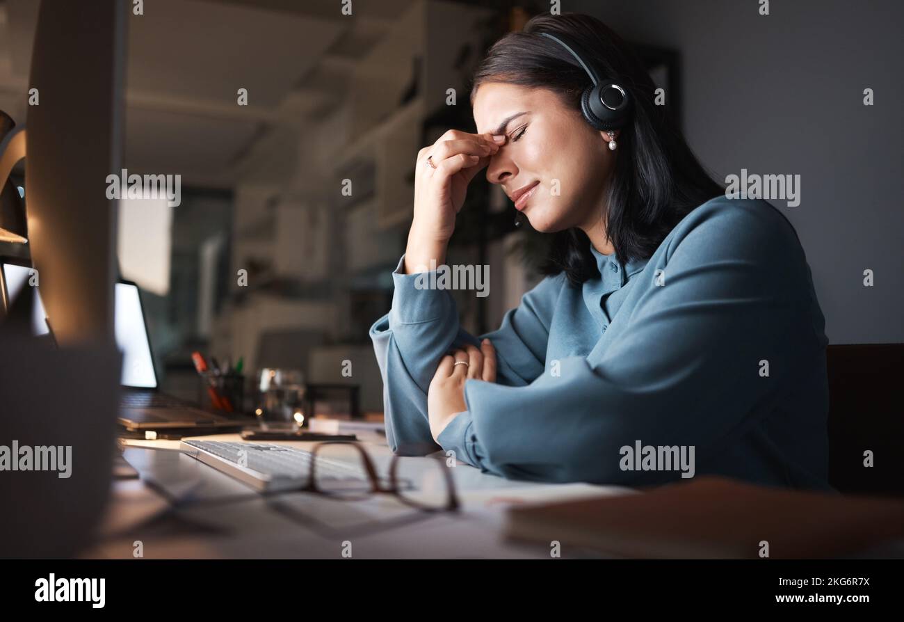 Stress, burnout and overtime, woman in call center with headache at crm ...