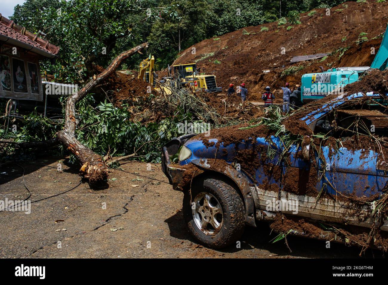 Cianjur, West Java, Indonesia. 22nd Nov, 2022. A damaged car hit by a landslide in Cugenang ...