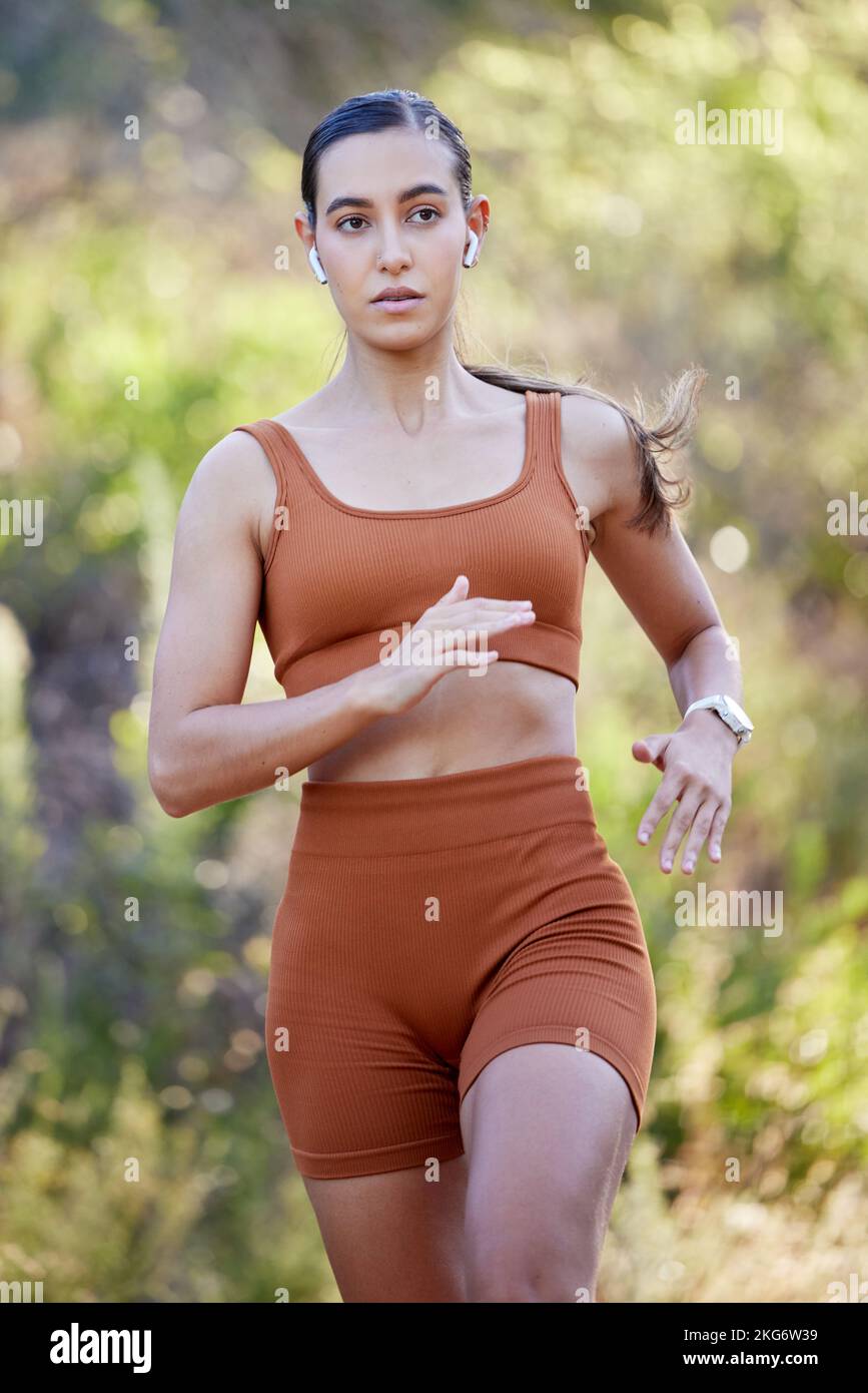 Girl in sportswear jogging forest hi-res stock photography and images ...