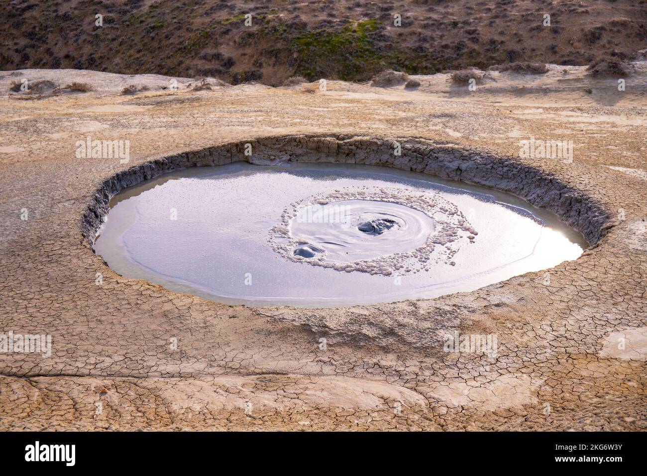 A beautiful, round, seething mud volcano in the mountains. Gobustan. Azerbaijan Stock Photo - Alamy