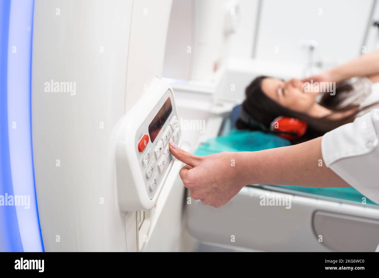 Female patient undergoing MRI - Magnetic resonance imaging in Hospital ...