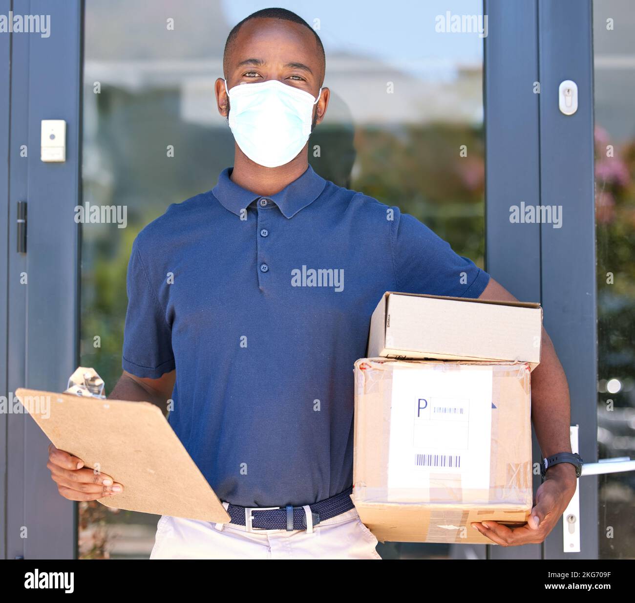 Delivery man employee face mask hi-res stock photography and images - Alamy