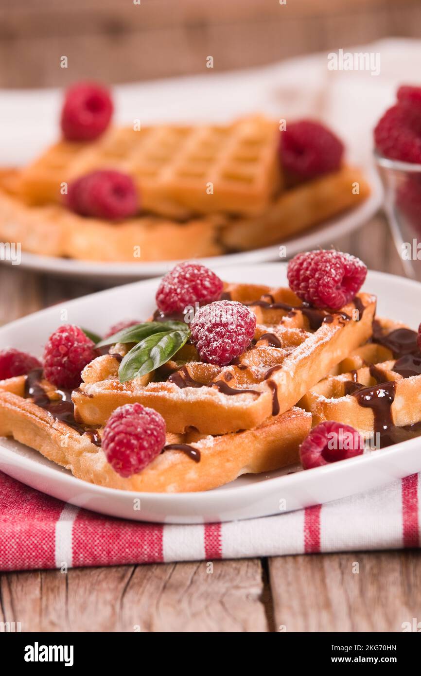 Waffles with raspberries and chocolate cream Stock Photo - Alamy