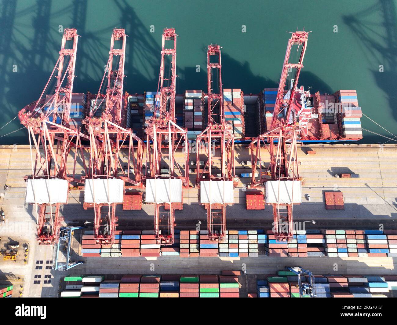 Aerial photos show cargo ships loading and unloading containers at the ...
