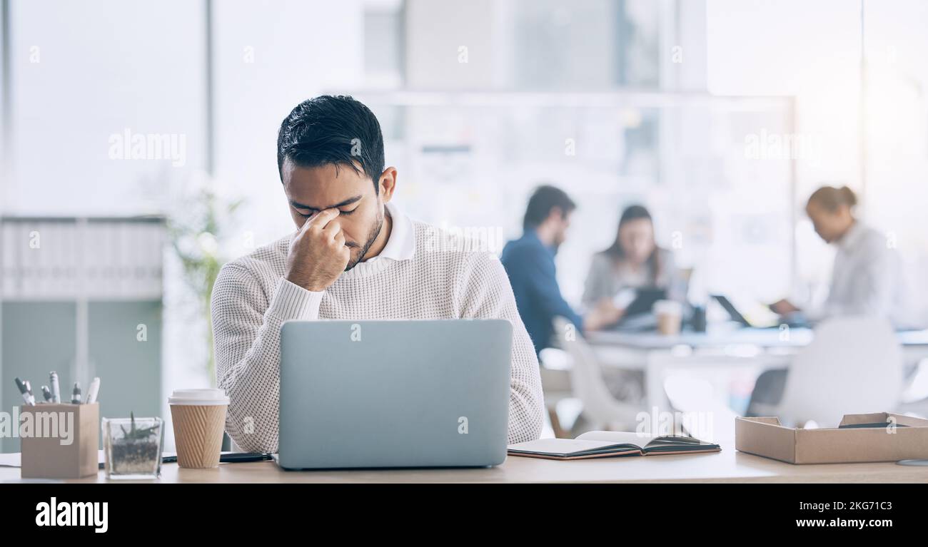 Headache, stress and laptop with a business man at work in his office ...