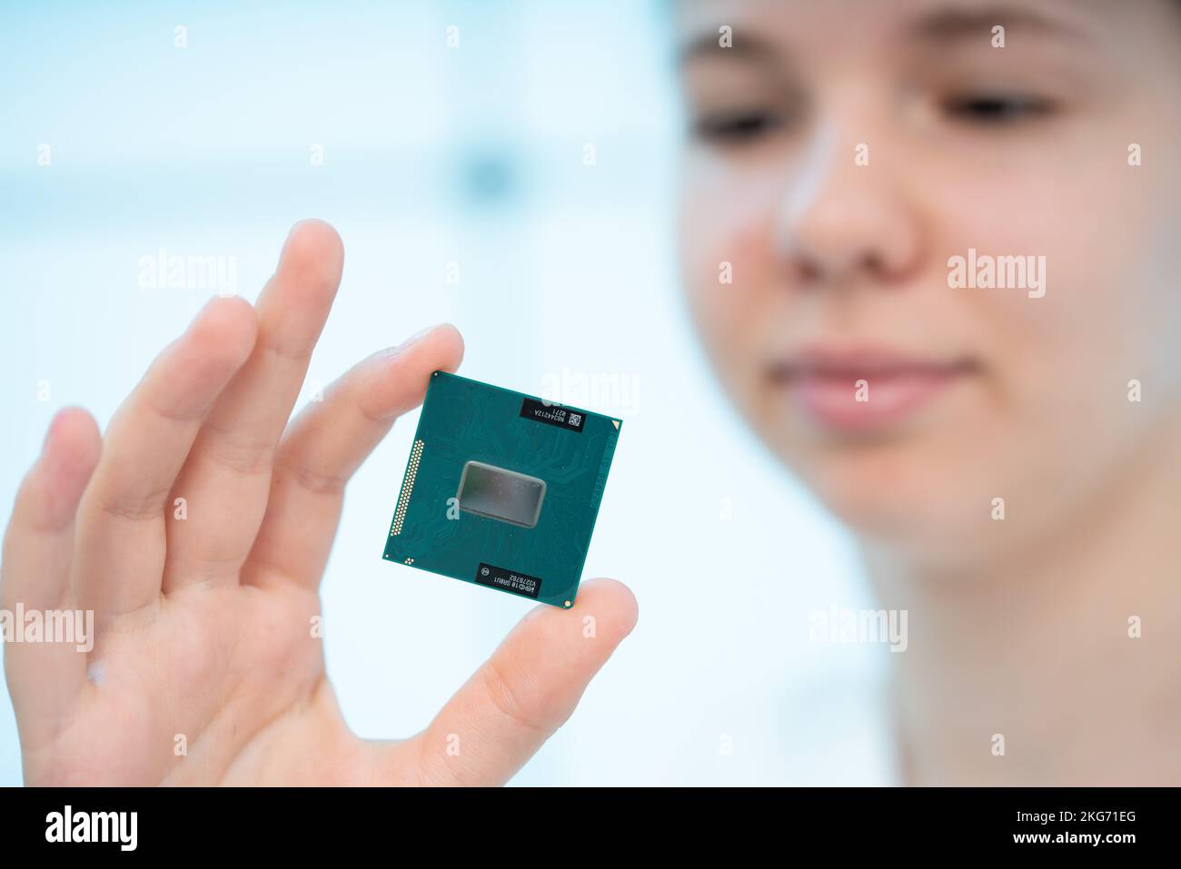 CPU crystal for using laptop and tablets in the hands of a young woman ...