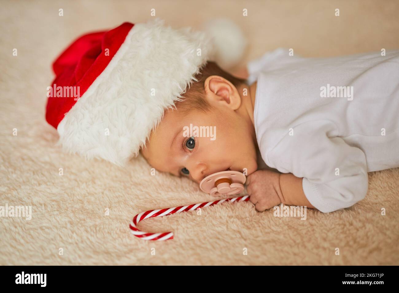 Little sleeping newborn baby, wearing Santa hat Stock Photo - Alamy