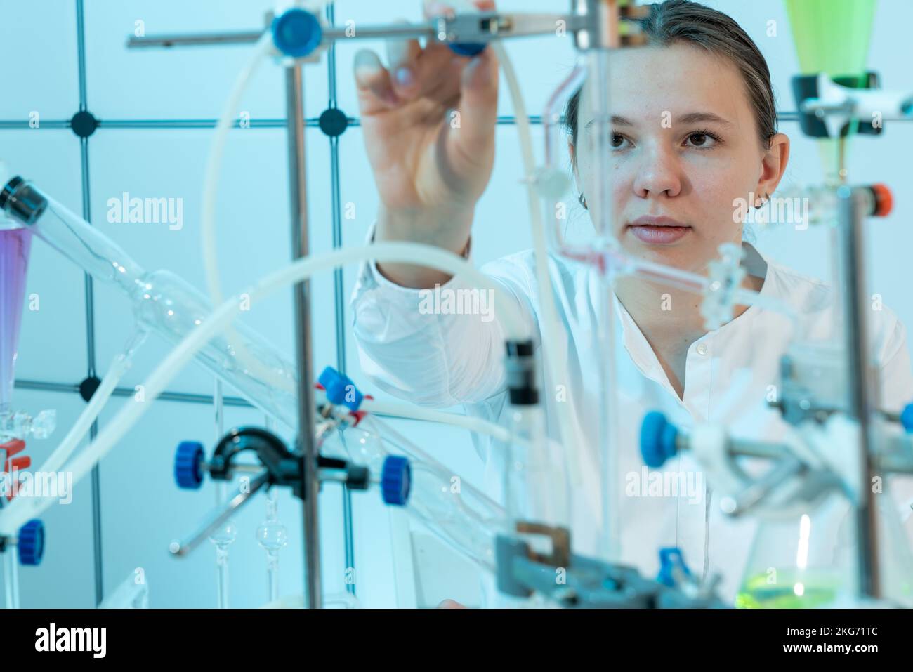 young woman laboratory assistant analyzes the water from the river for ...