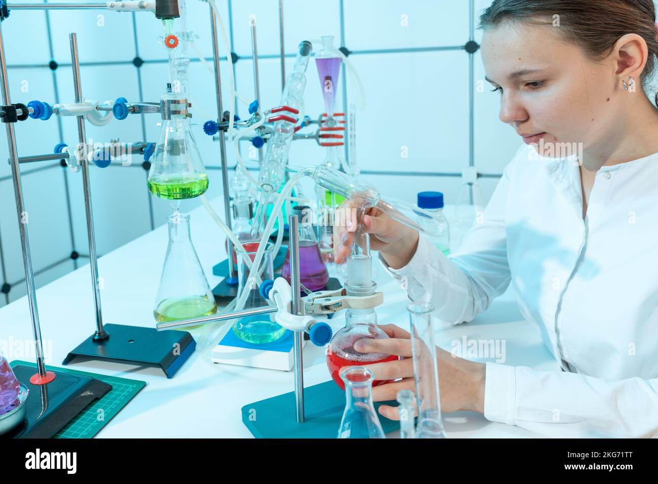 young woman laboratory assistant analyzes the water from the river for ...