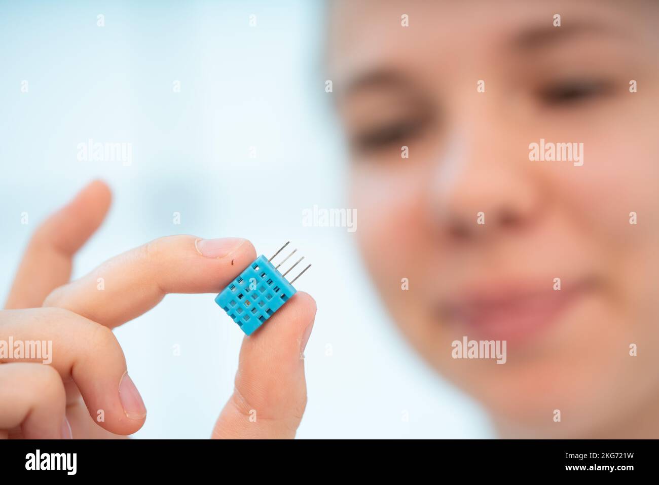 Young Woman Holds A Poison Gas Sensor In Her Hands To Monitor Air