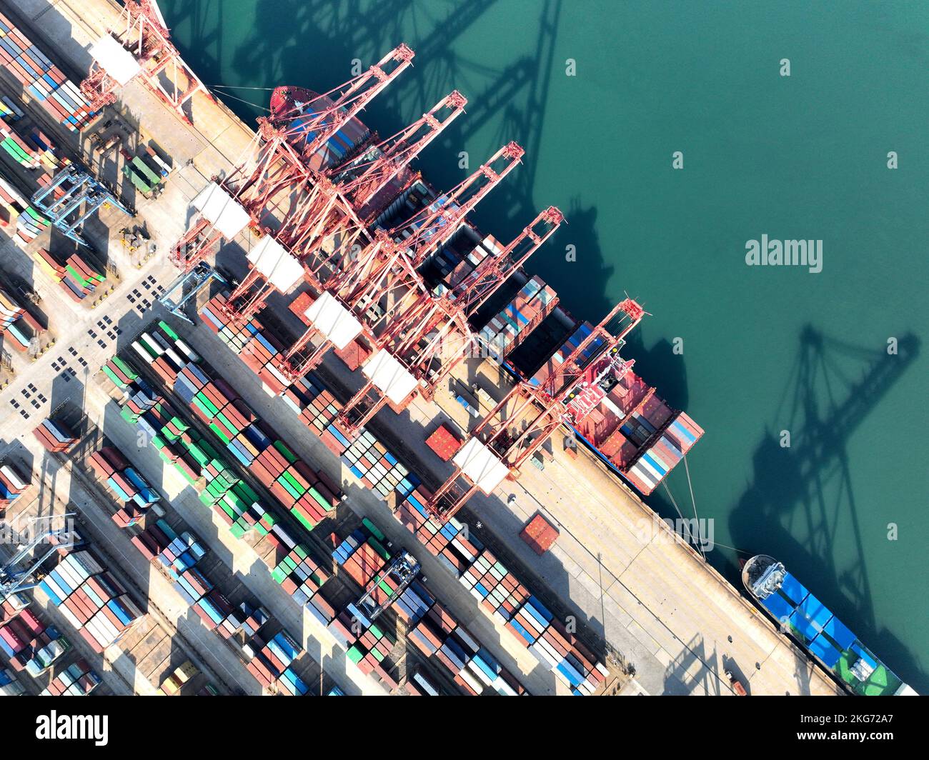 Aerial photos show cargo ships loading and unloading containers at the ...