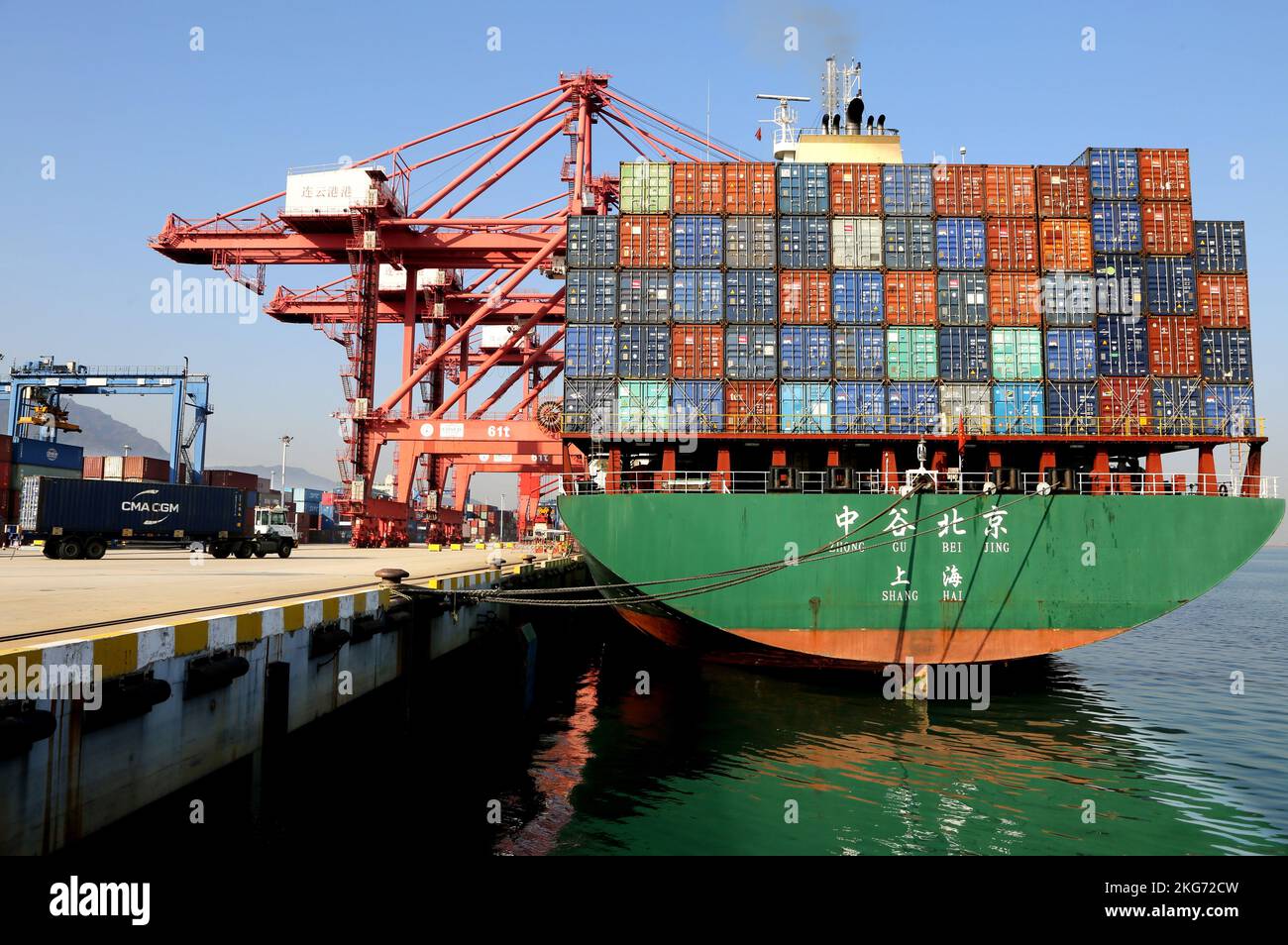 Aerial photos show cargo ships loading and unloading containers at the ...