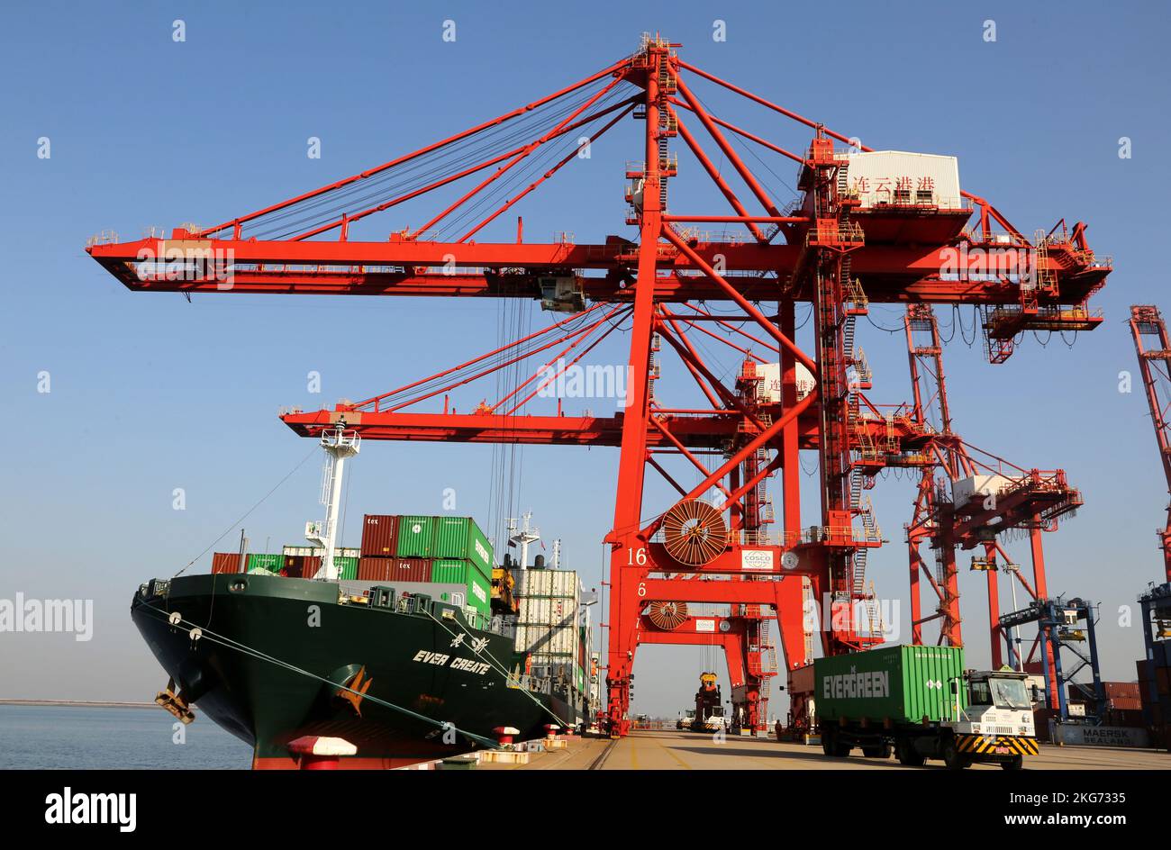 Aerial photos show cargo ships loading and unloading containers at the ...