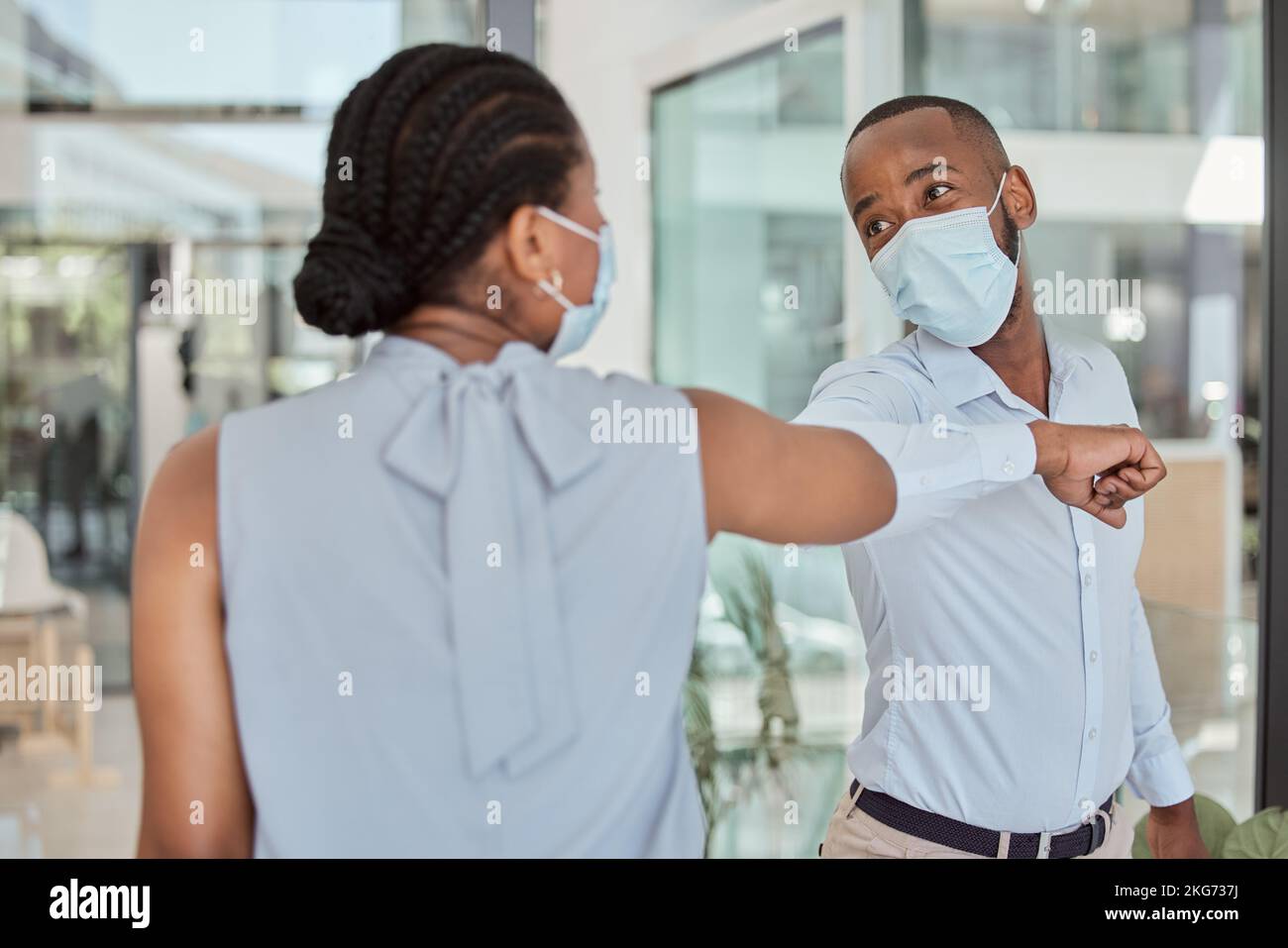 Covid, elbow greeting and business people with face mask for office ...