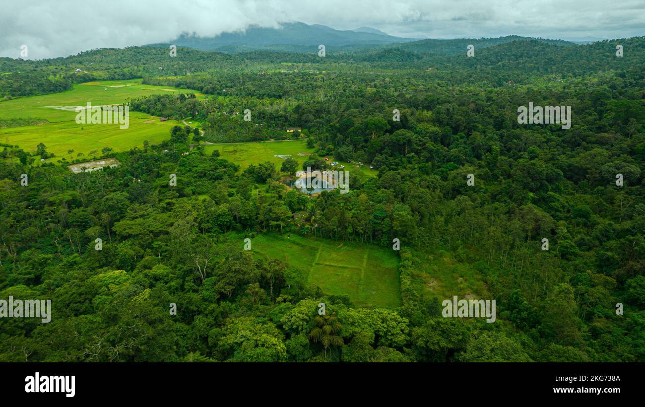 An aerial view of a beautiful landscape with green forests and meadows ...