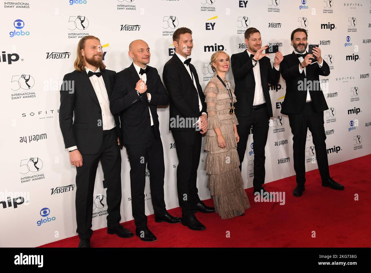 Mari Walther Svenning and Ole Petter Klepp, with team, walking the red ...